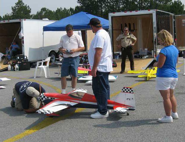 Men starting up model flying club - Coastal Courier