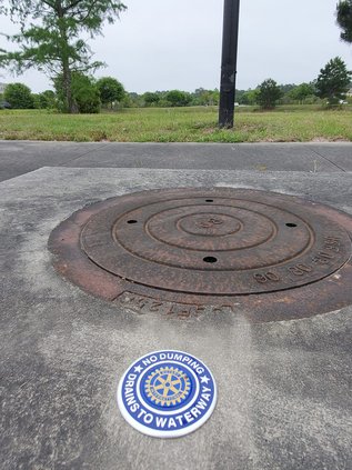 Hinesville Rotary Club installs storm drain markers - Coastal Courier