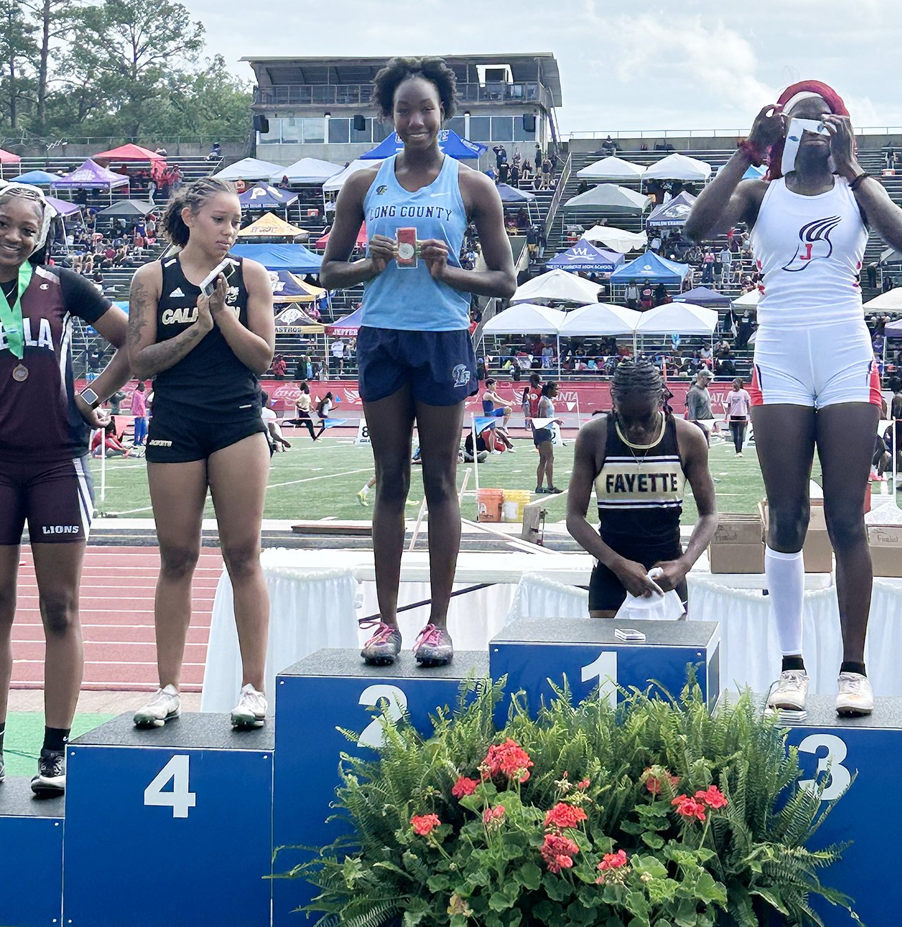 Smith medals in three events at state track meet - Coastal Courier